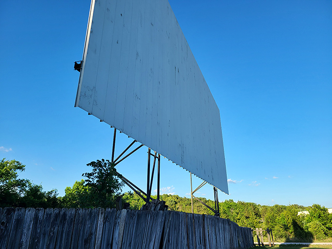 The towering screen structure reveals its impressive scale in daylight, a monument to outdoor entertainment that's weathered decades of changing entertainment trends.