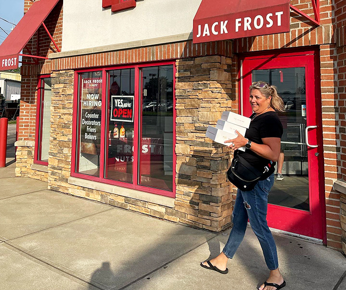 The universal joy of walking away with that distinctive red and white box. What's inside won't survive the car ride home.