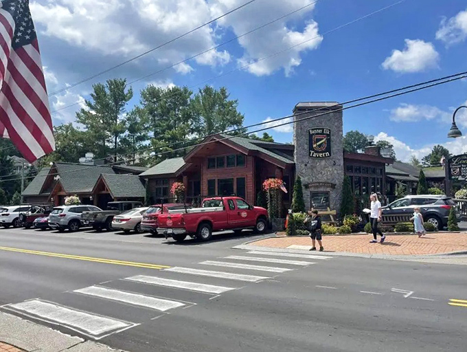 Kettle Falls Tavern anchors the corner of Banner Elk's main street, where American flags and hanging flower baskets compete for patriotic charm.