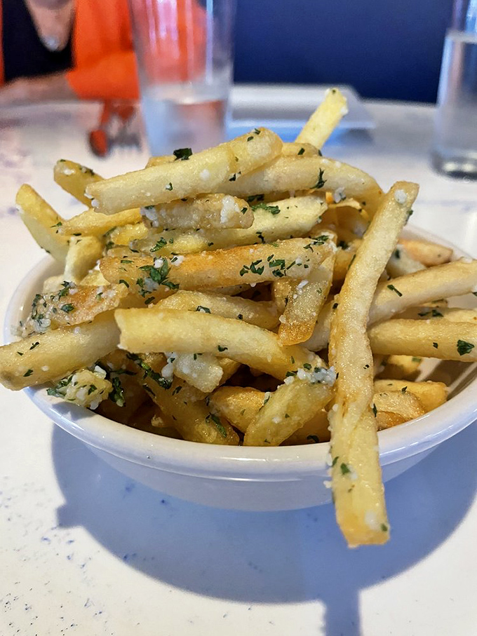 These aren't just fries; they're potato sticks that went to finishing school. The herbs and salt make them dangerously addictive.
