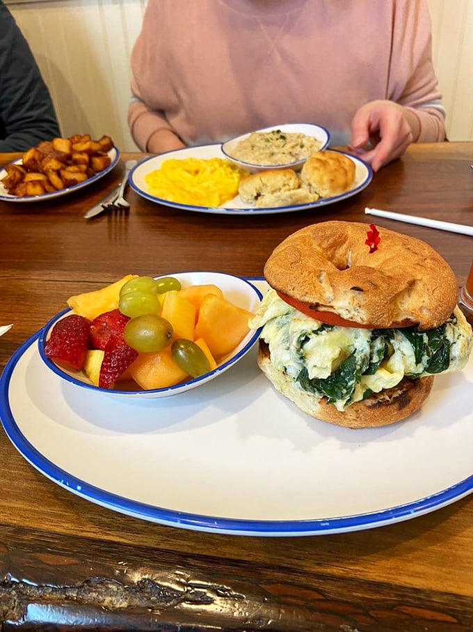 A breakfast sandwich that makes Monday mornings bearable, paired with fruit so fresh it's practically still photosynthesizing.