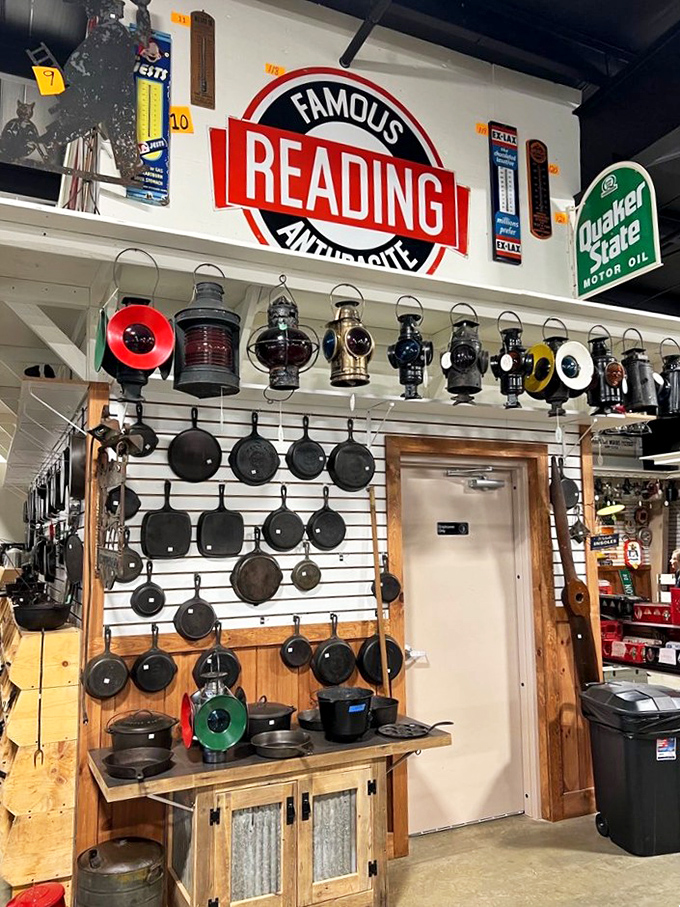 Cast iron paradise meets vintage lighting gallery. That skillet collection has probably fried more eggs than all the diners in Ohio combined.