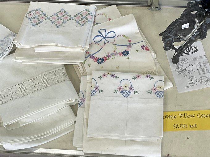 Embroidered pillowcases that someone's grandmother lovingly stitched, now waiting for their next chapter in your guest room.