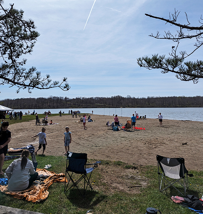 The beach scene at Kiser Lake: where kids build sandcastles while parents build memories that last generations.