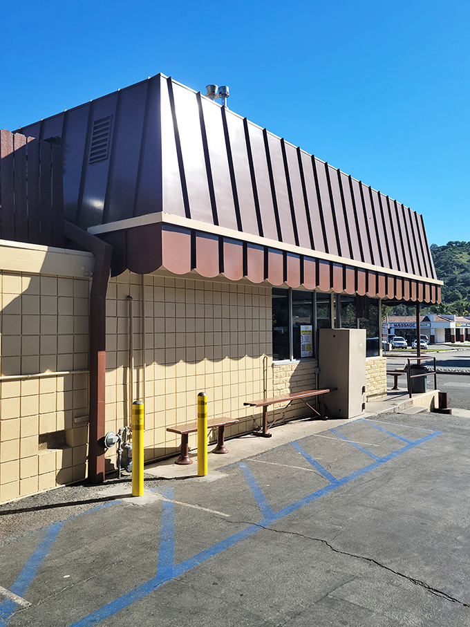 The side view reveals the shop's no-frills approach &ndash; it's not about fancy architecture, it's about what's happening inside those doors.