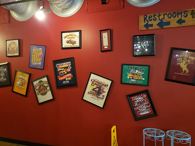 The wall of framed Louisiana memorabilia serves as both decoration and education&mdash;a colorful reminder you're in Cajun territory now.