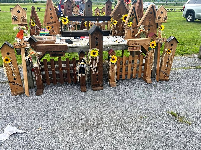 Birdhouse village! These sunflower-adorned wooden homes await feathered residents and garden corners in need of charm.