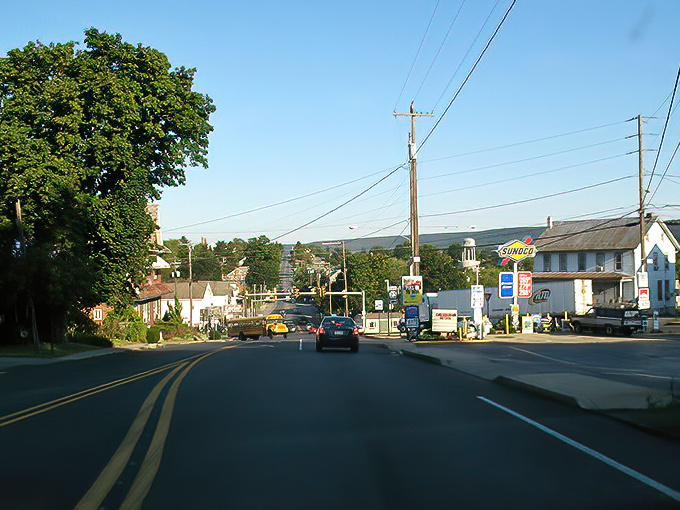 The roads of Blue Ball lead to adventures in every direction, with mountains rising in the distance beyond this charming town.