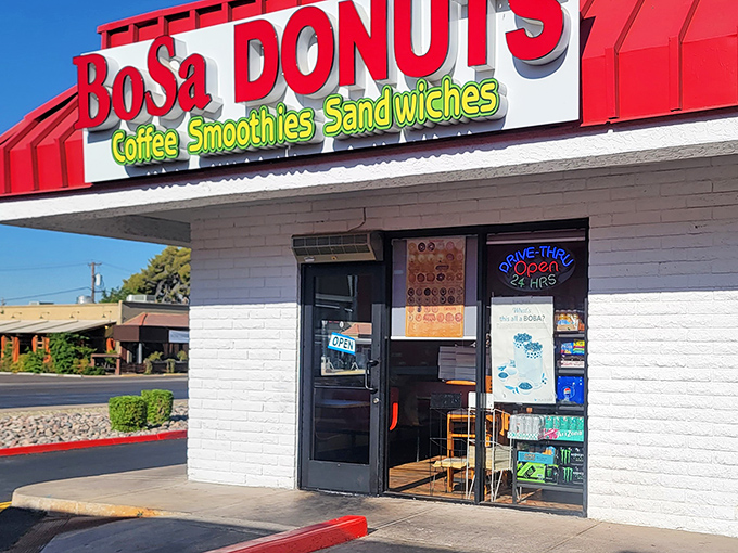 BoSa Donuts' bright red signage cuts through the desert landscape like a sweet salvation. 