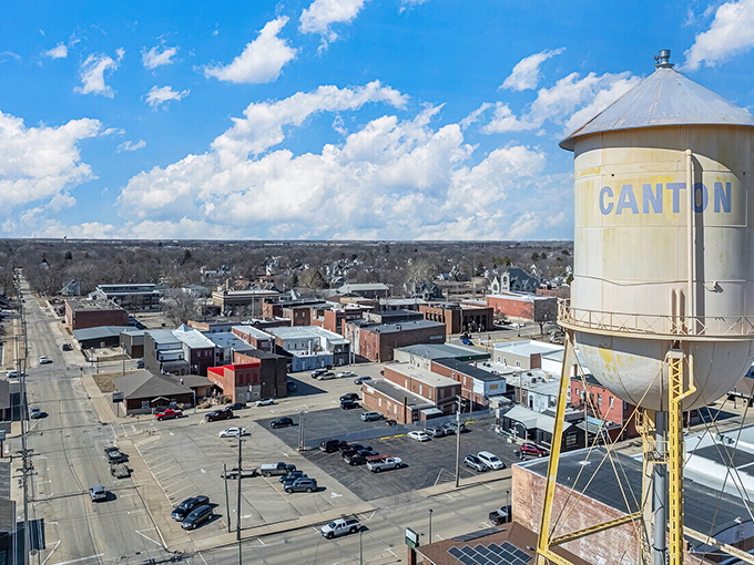 The water tower stands sentinel over streets where neighbors still wave to each other.