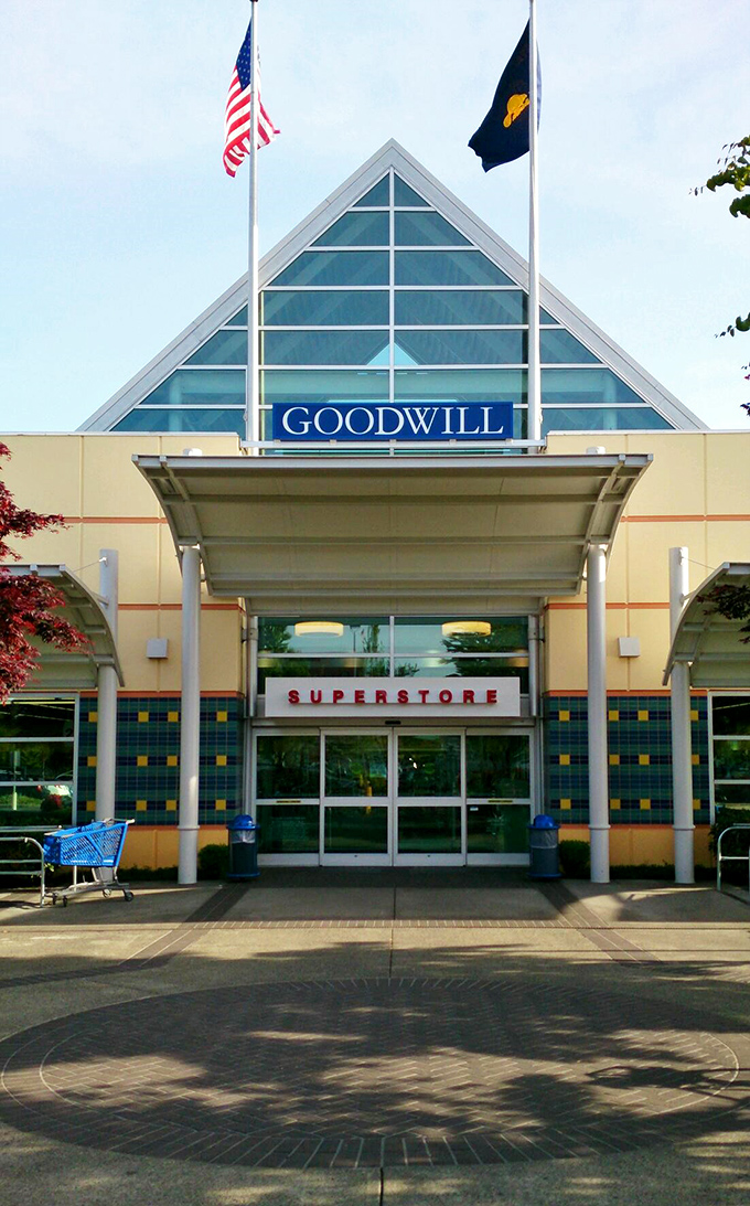 Goodwill's triangular glass entrance creates an upscale thrift experience that rivals any traditional department store.
