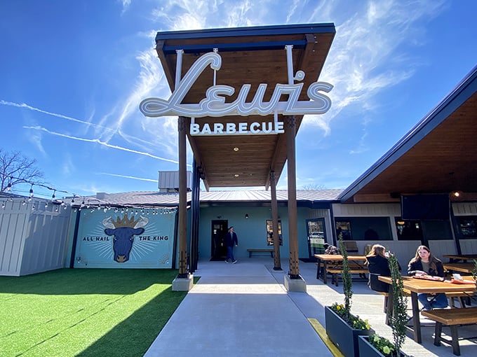 Lewis Barbecue's modern entrance and outdoor seating area &ndash; where Texas meets Carolina in meaty harmony.