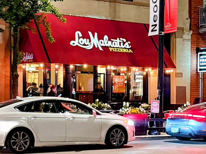Lou Malnati's red awning glows like a pizza beacon in Chicago's theater district &ndash; showtime for your tastebuds.
