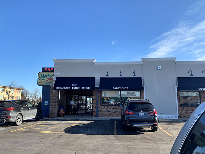 Blue awnings and brick charm create the perfect neighborhood diner atmosphere - comfort food central right here.