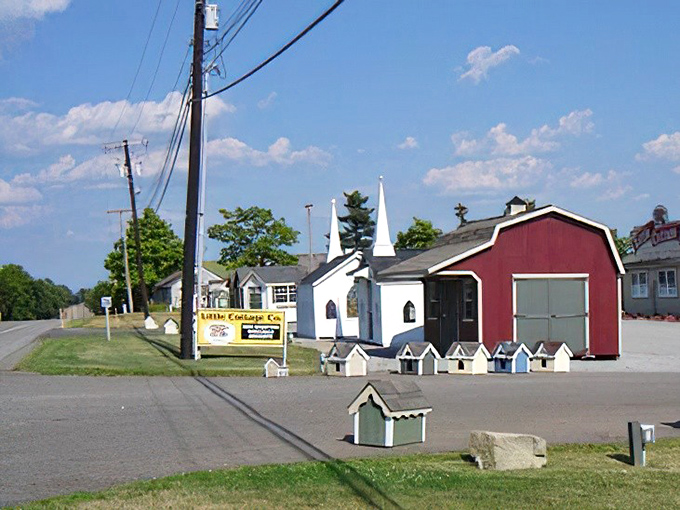 A miniature church and birdhouse display - where even the birds enjoy meticulously crafted Amish architecture.