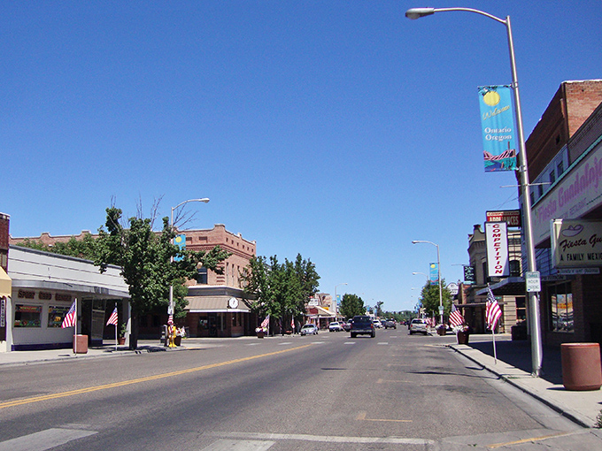 Classic main street America stretches toward distant mountains where big dreams still feel possible.