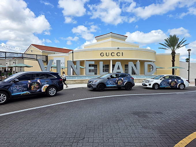 That Gucci storefront says "luxury," but the outlet prices whisper "you can actually afford this."