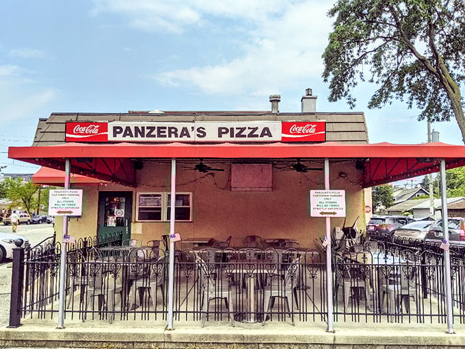 Panzera's patio awaits with the promise of pizza al fresco. That red awning signals delicious things happening inside.