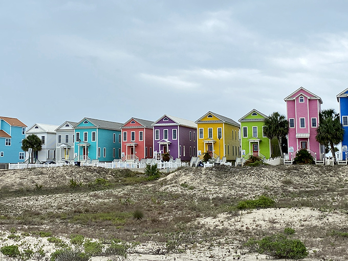 Rainbow-colored beach houses standing like a box of Good Humor bars melting into the coastal landscape.