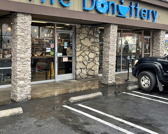 Stone columns and modern design prove that donut shops can be architectural statements without sacrificing soul.