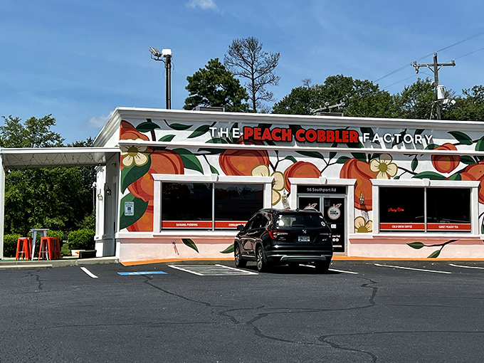 The Peach Cobbler Factory's vibrant mural celebrates its namesake fruit with artistic flair. A feast for eyes and taste buds!