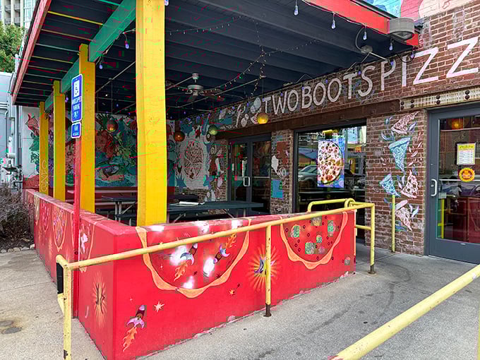 Two Boots' vibrant exterior bursts with artistic energy. Those colorful walls hint at the creative pizza combinations waiting inside.