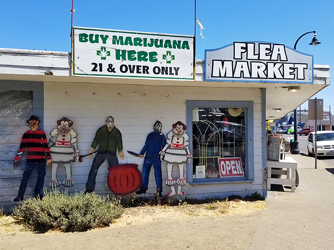 Waldport Fleamarket's quirky exterior promises coastal treasures and small-town charm behind its colorful painted characters and welcoming doors.