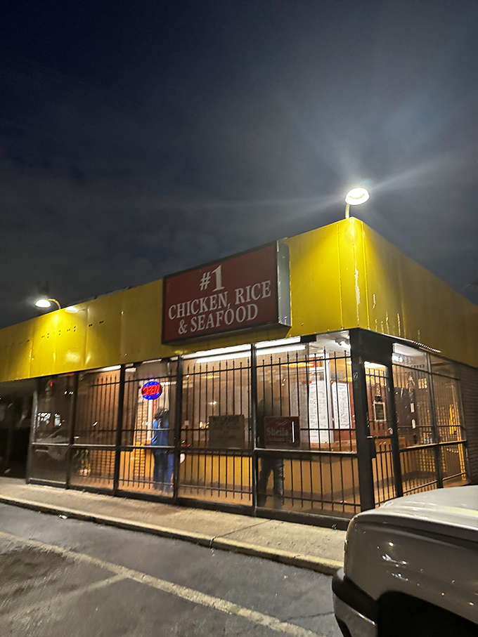 #1 Chicken Rice & Seafood night view: When darkness falls, this humble spot transforms into a beacon of crispy, juicy chicken salvation.
