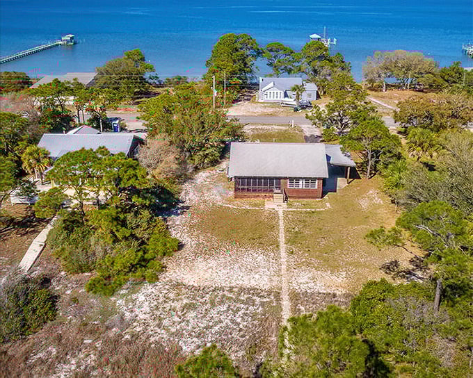 Alligator Point's rustic charm includes weathered cottages that have witnessed countless sunrises over the Gulf's gentle waters.