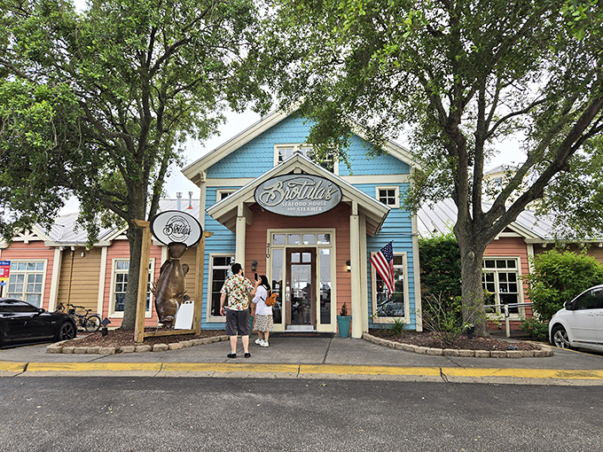 Shaded by ancient oaks, Brotula's charming entrance promises seafood sophistication in a setting that's pure Florida magic.