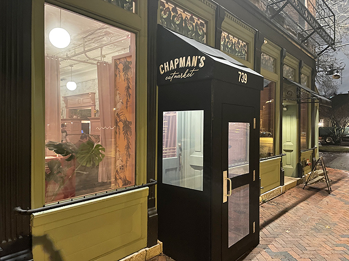 Chapman's Eat Market's elegant black entrance beckons food lovers inside. Behind those doors, comfort classics meet creative culinary magic.