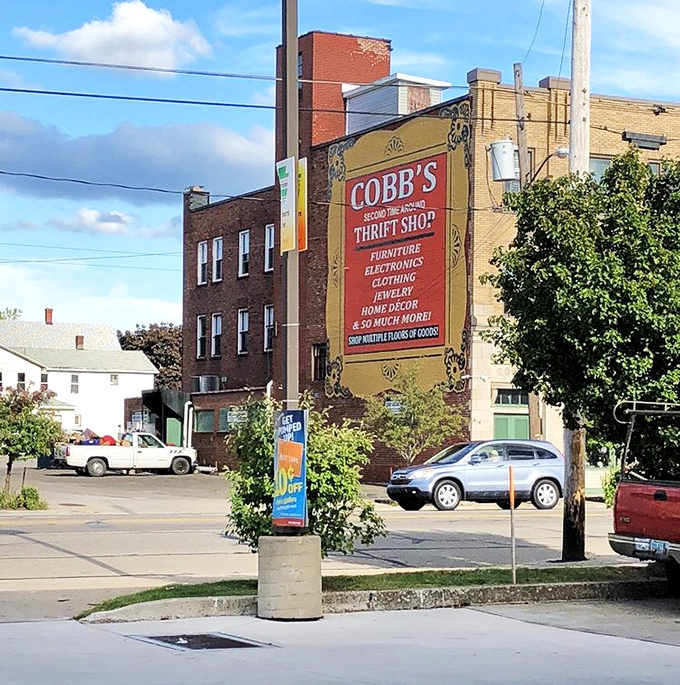 The bold mural announces Cobb's presence with vintage flair. This brick behemoth has witnessed decades of bargain hunting joy.