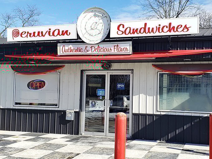 The checkered entrance floor at Don Juan V's sets the stage for a sandwich experience that's anything but ordinary.