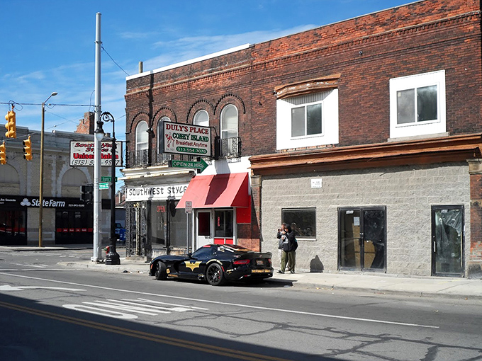 The classic Detroit streetscape frames this corner institution like a perfectly composed urban love letter.