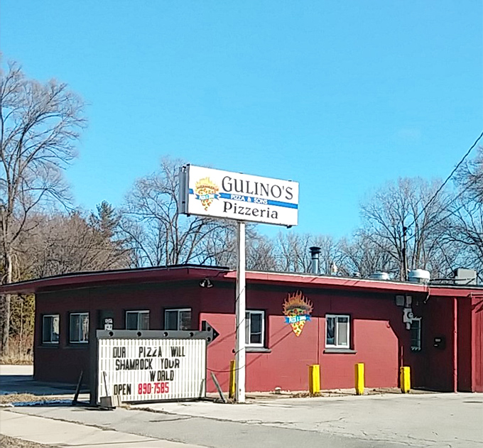 Classic small-town pizza parlor charm where the simple sign promises big flavors and even bigger community spirit.
