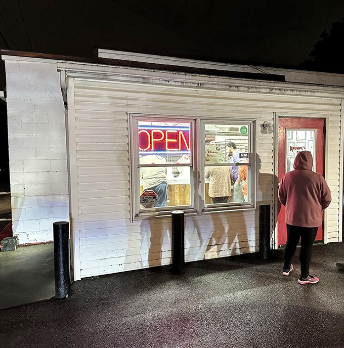 That red door opens to nearly a century of donut perfection - some traditions never fade.