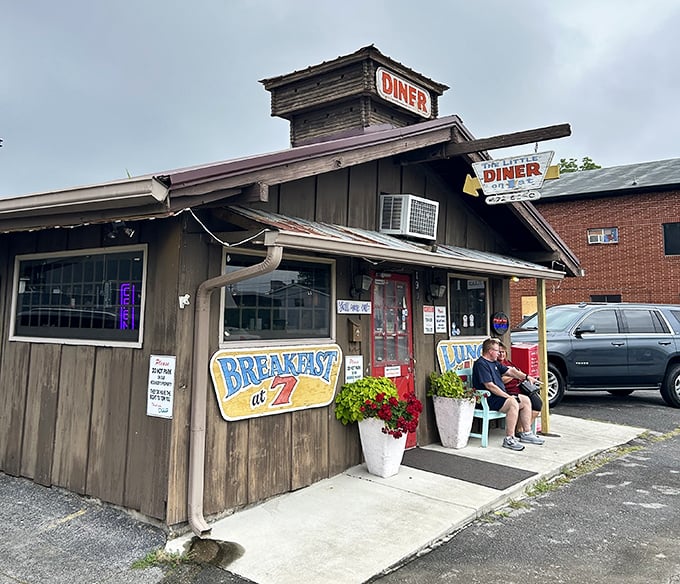 That bright red door practically begs you to come inside. The turquoise bench offers a perfect perch while waiting for a table.