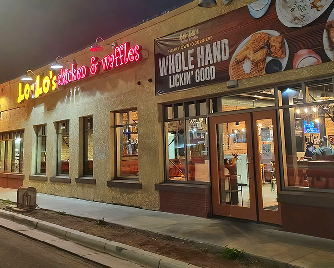 Chicken and waffles under neon lights - sometimes the most unlikely pairings create the most memorable meals.