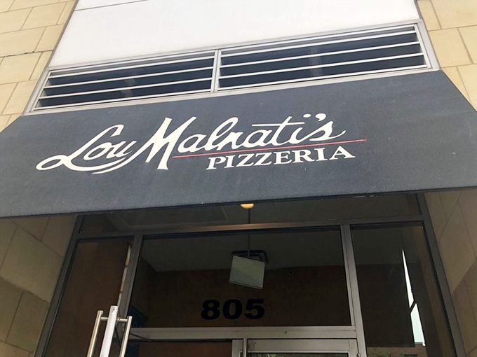 That elegant awning promises pizza experiences worthy of special occasions and everyday cravings alike.