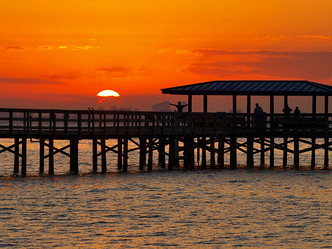 Sunset paints the marina in golden hues, where boats bob peacefully and every evening feels like a postcard moment.