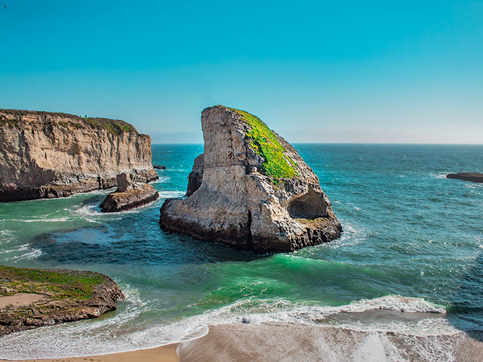 The emerald waters around Shark Fin Cove create a striking contrast with the rugged cliffs&mdash;California coastal perfection.