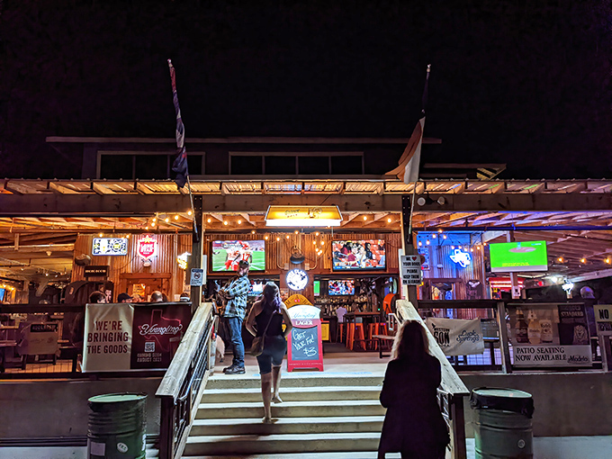 Flags flutter above South Austin Beer Garden's outdoor space, where dogs, humans, and cold beer create perfect harmony.