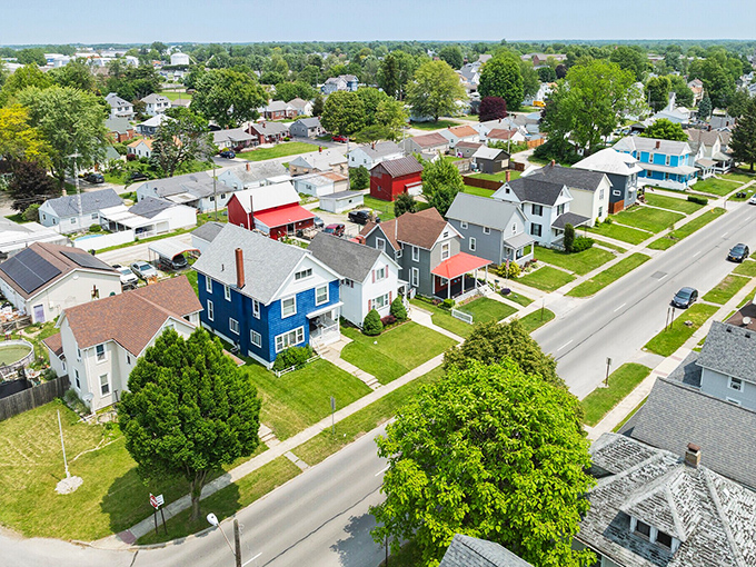 Tree-shaded neighborhoods spread across Tiffin like a green carpet, where affordable homes nestle under nature's own umbrella.