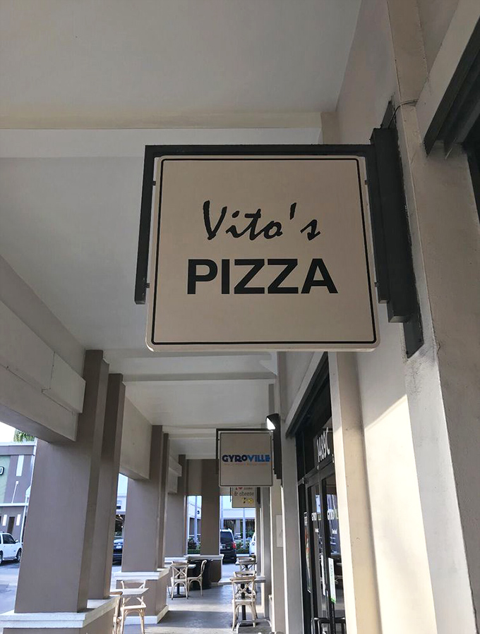 The welcoming entrance promises handcrafted pizza perfection waiting just beyond those inviting glass doors.