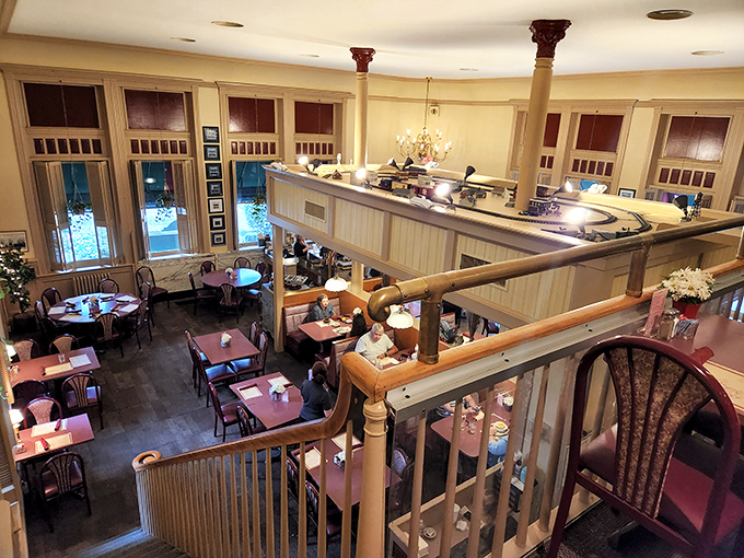 The mezzanine dining area offers a bird's-eye view of the culinary magic below. Like stadium seating, but for pancake watching.