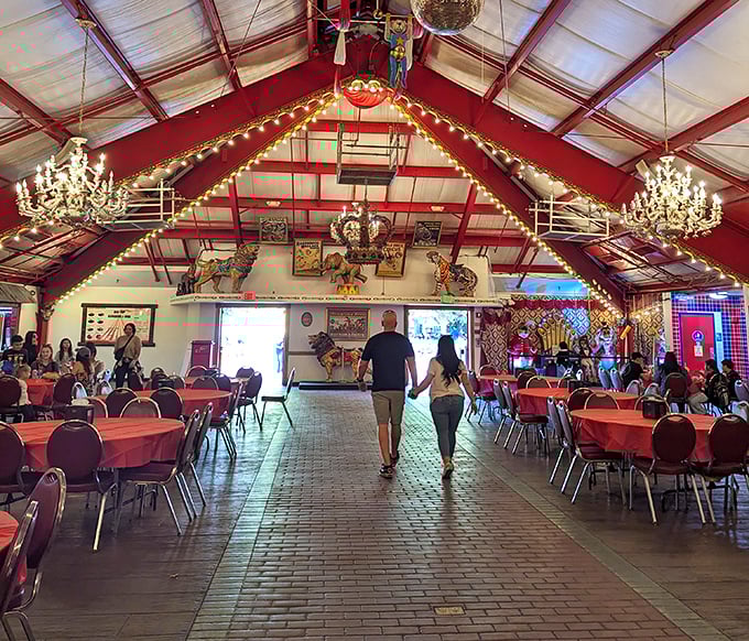 Al's Big Top BBQ dining area combines medieval castle vibes with circus flair. Those chandeliers have witnessed countless birthday celebrations and sugar-fueled family negotiations.