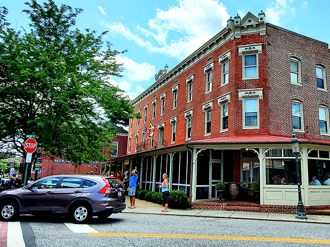 The Atlantic Hotel anchors Berlin's historic district like a grand old ship, its wraparound porch the perfect vantage point for people-watching with a cocktail in hand.