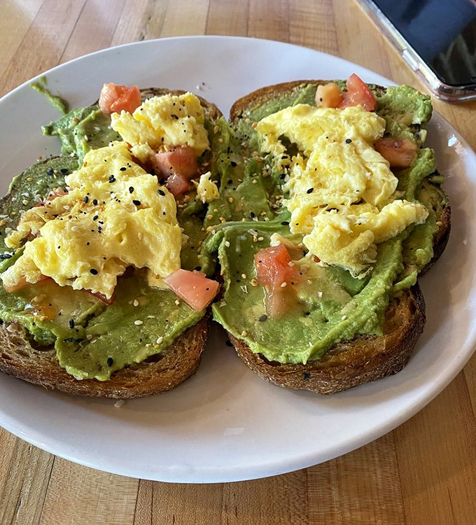 Avocado toast elevated to art form – creamy, colorful, and Instagram-worthy without trying too hard to impress.