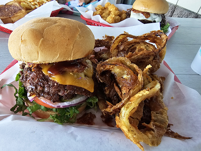 A barbecue cheeseburger and onion rings that make such a perfect pair, they should consider getting a joint checking account.