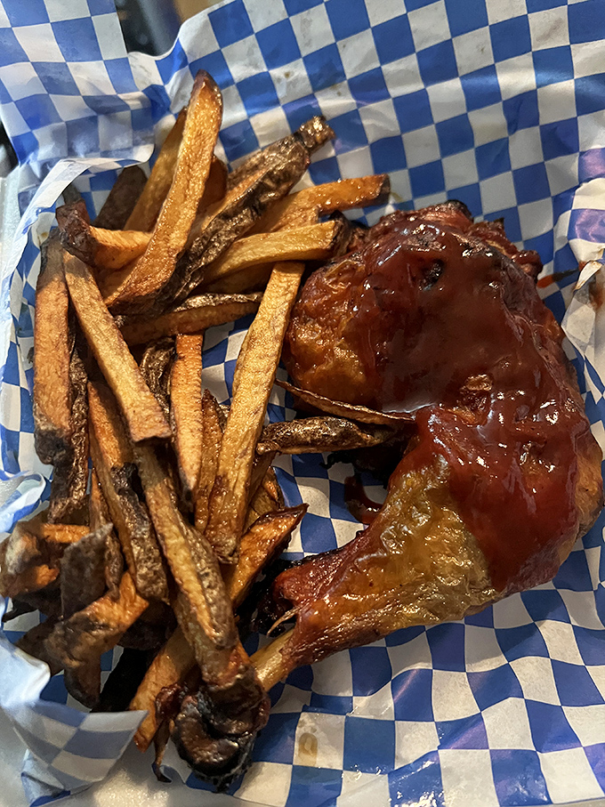 BBQ chicken that's had a proper smoke bath before getting dressed in that glossy sauce, with hand-cut fries playing the perfect supporting role.